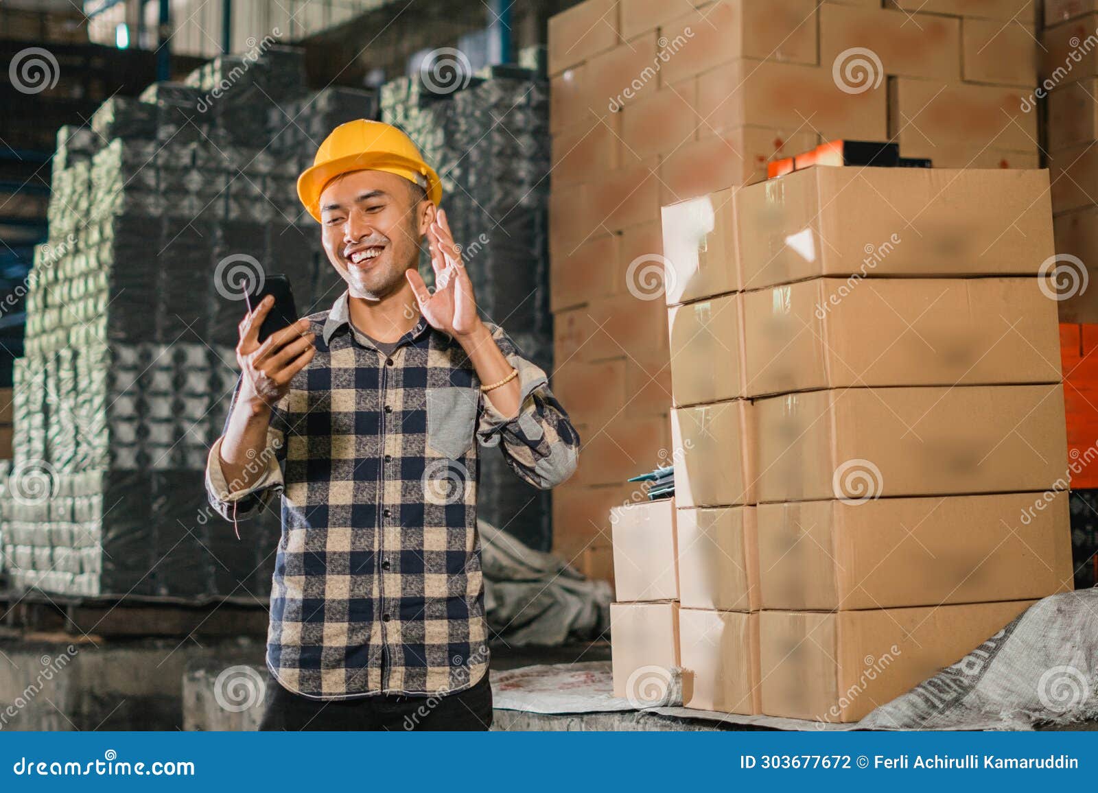 Male Factory Worker Makes Video Call with Cell Phone while Working ...