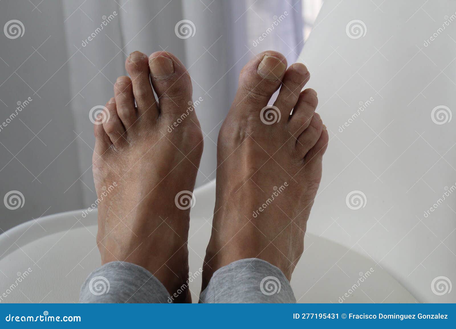 Male Feet Leaning on a Chair Resting Stock Image - Image of resting ...