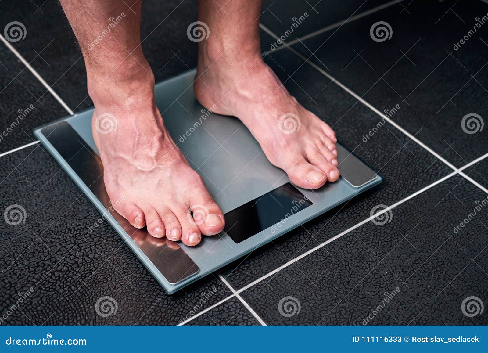 Male feet on the scale stock image. Image of person - 111116333