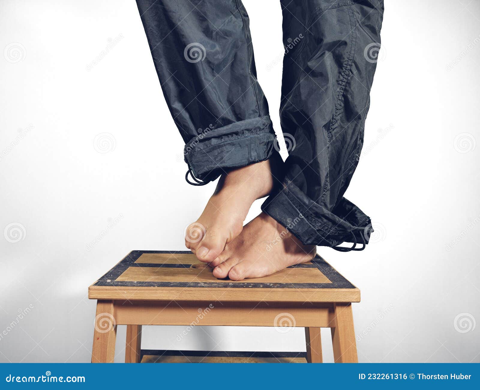 Male Feet Standing Barefoot on Chair Making Pose Stock Photo - Image of ...