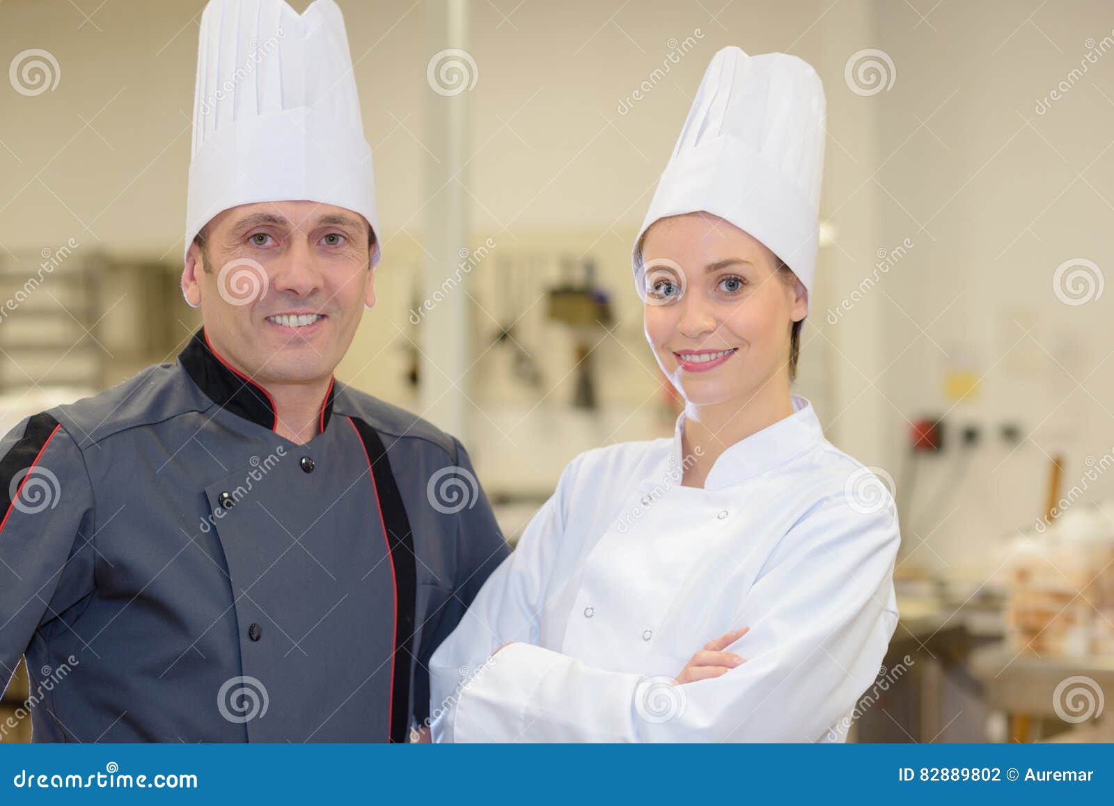Male and Female Chef Posing in Restaurant Kitchen Stock Photo - Image ...