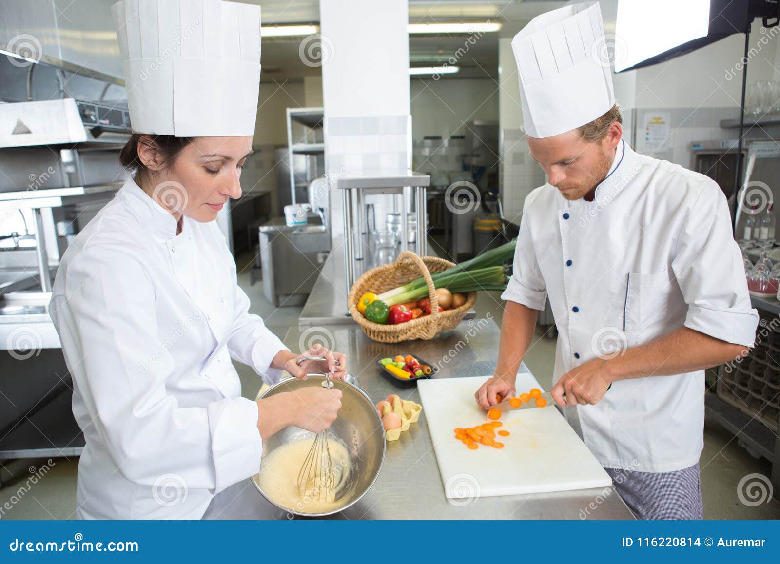 Male and Female Chefs Prepping Stock Photo - Image of dicing, prepping ...
