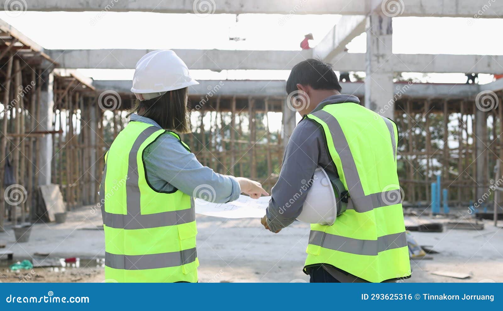 Male and Female Civil Engineers Inspect and Analyze Projects Under ...