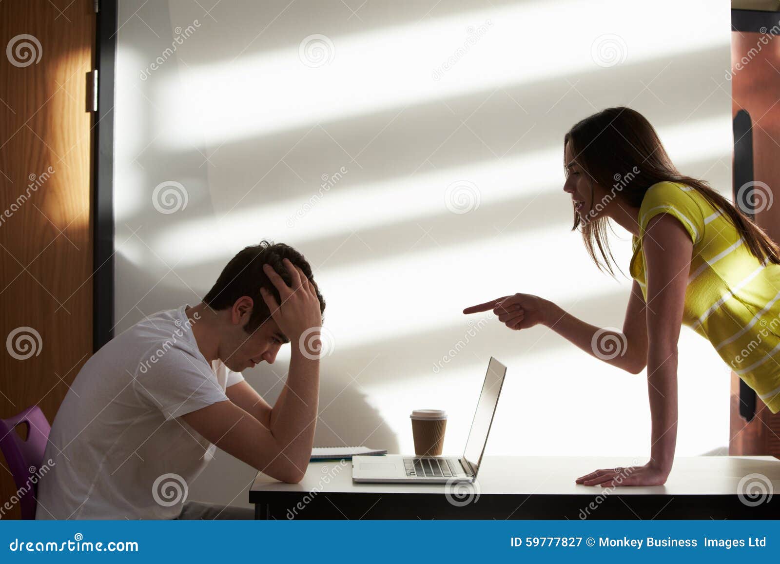 Male and Female College Students Arguing in Classroom Stock Image ...