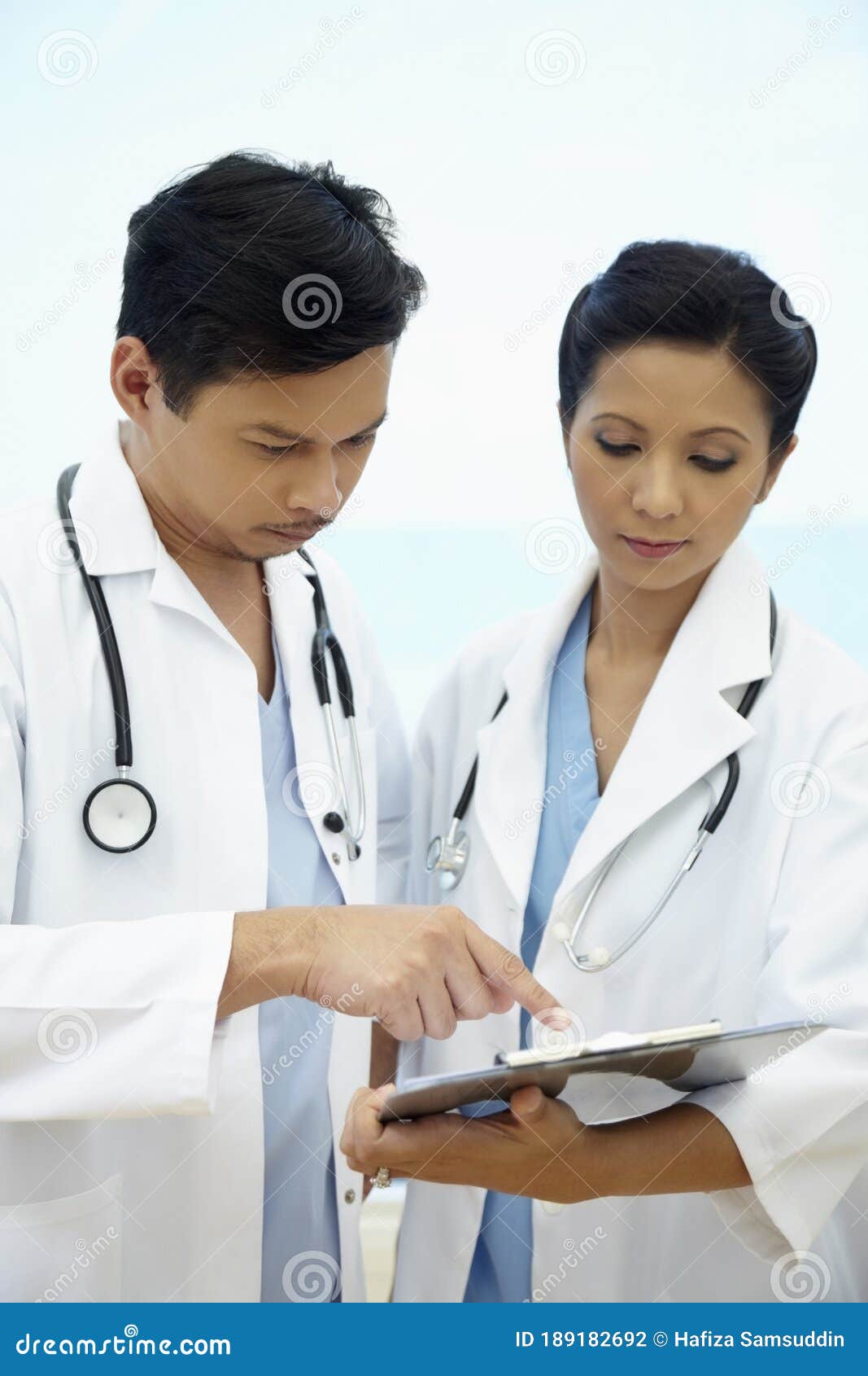 Male and Female Doctors Having Discussion. Conceptual Image Stock Photo ...