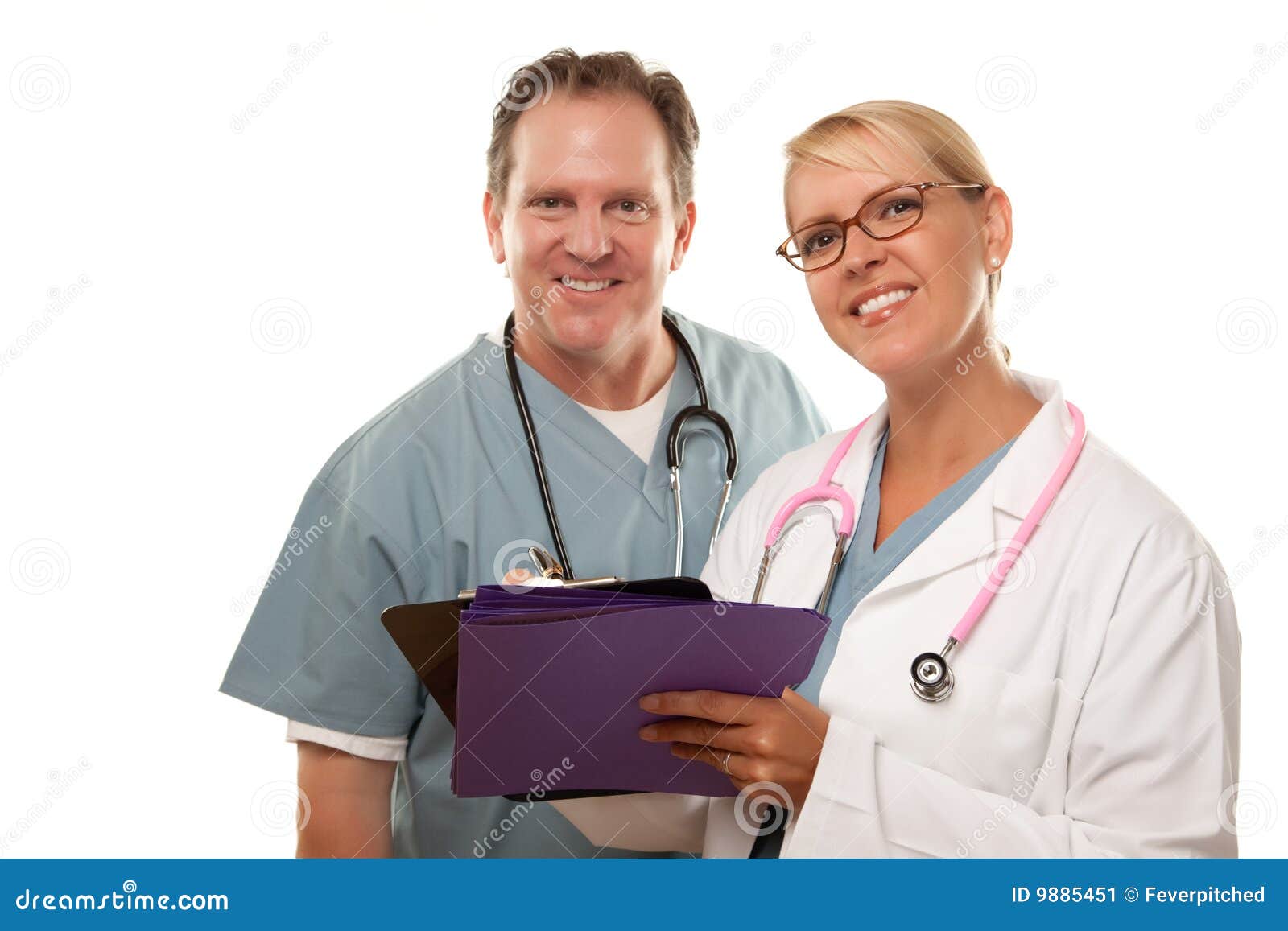 Male and Female Doctors Looking Over Files Stock Image - Image of ...