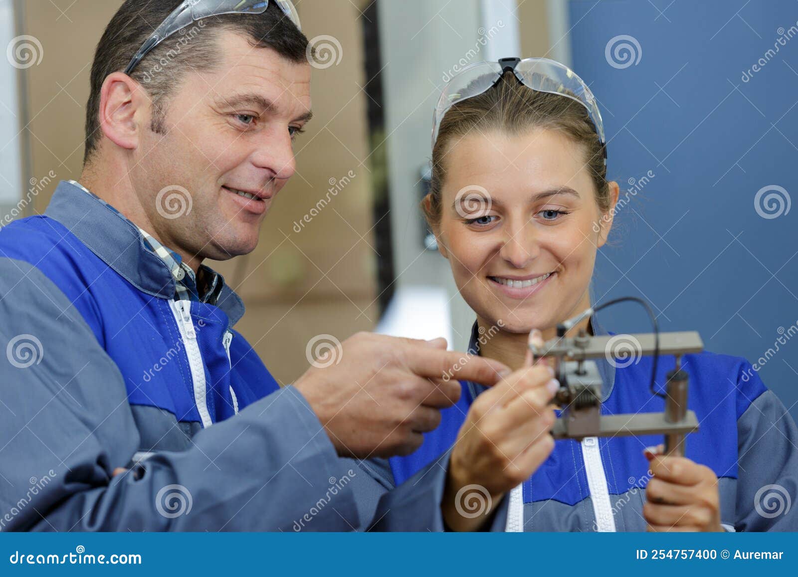 Male and Female Engineers Looking at Sensor Stock Photo - Image of ...