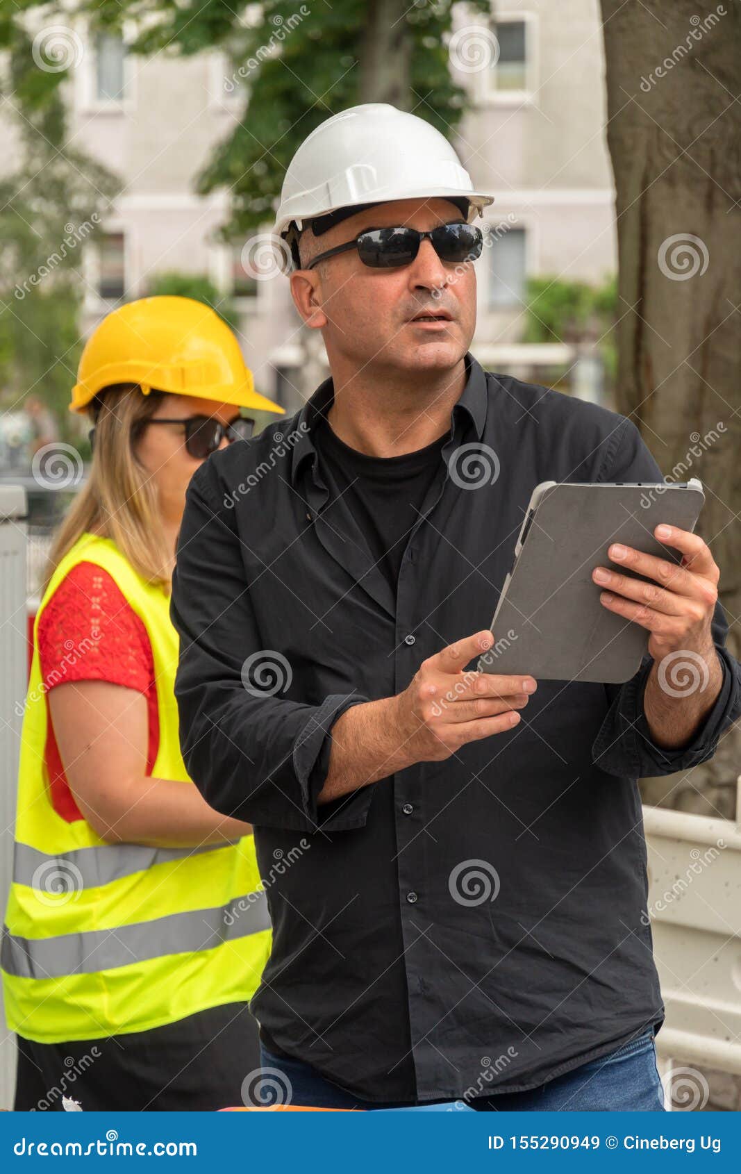 Male and Female Engineers at Work on Construction Site Editorial Stock ...