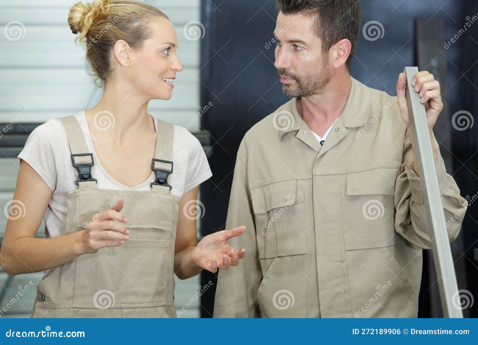Male and Female Factory Workers in Conversation Stock Photo - Image of ...