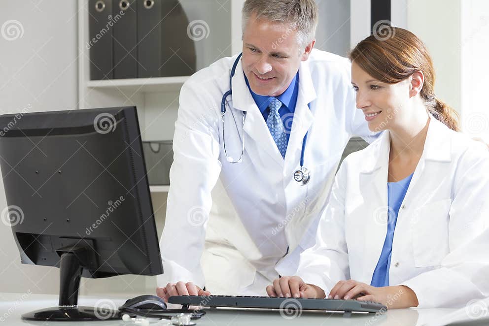 Male Female Hospital Doctors Using Computer Stock Photo - Image of ...