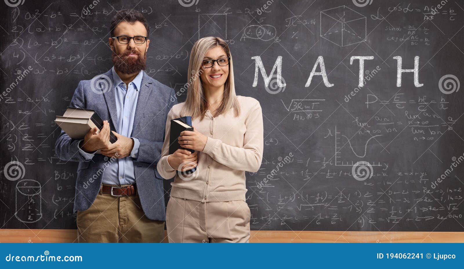 Male and Female Math Teacher in Front of a Blackboard with Text and ...