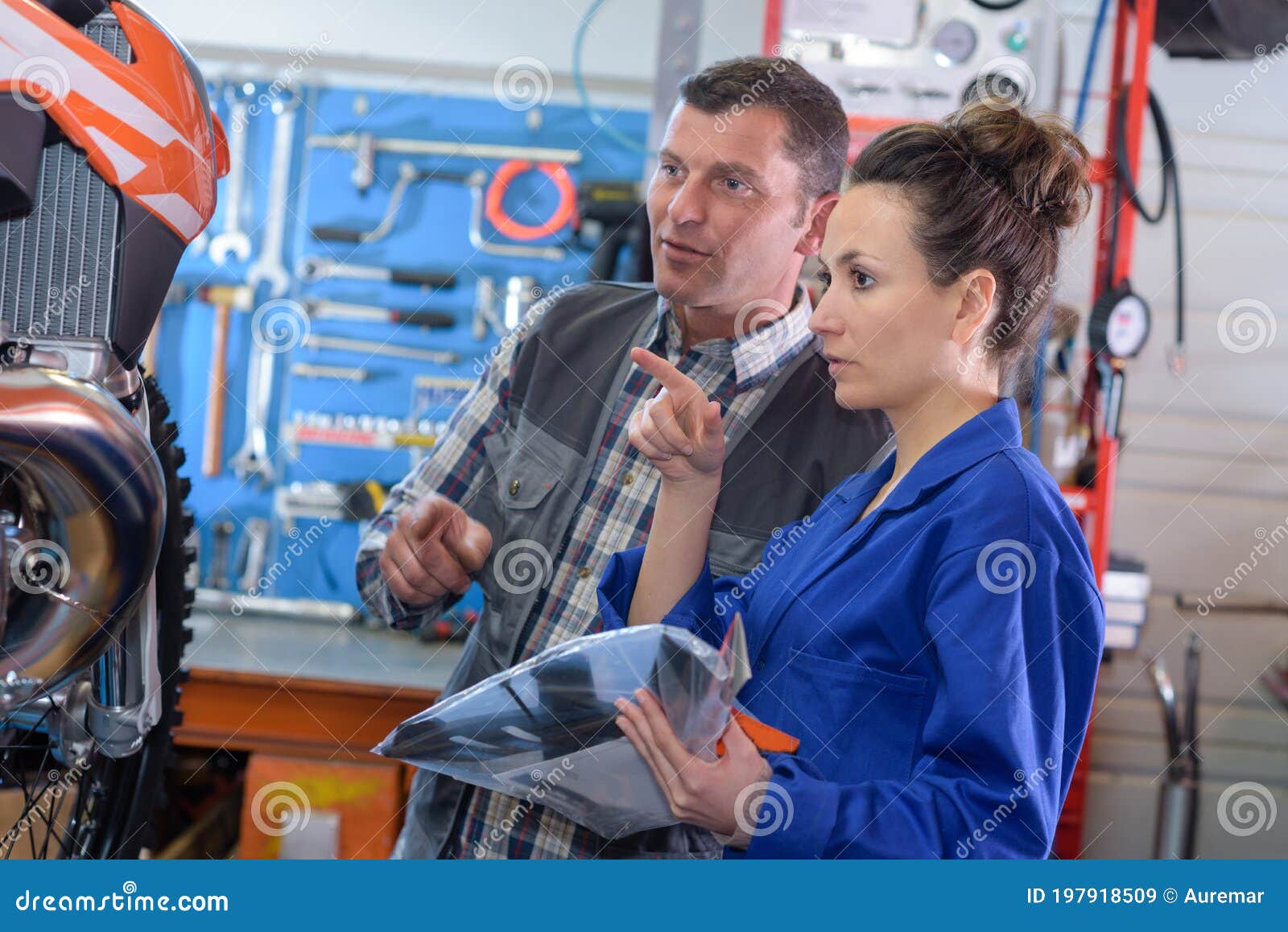 Male and Female Mechanics Working Together Stock Image - Image of piece ...