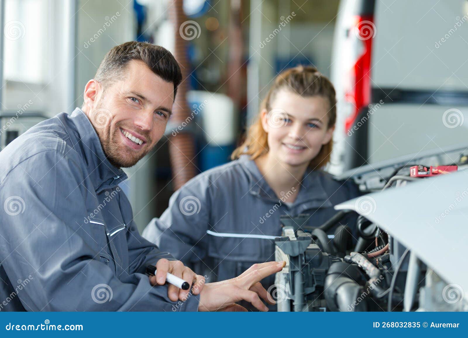 Male and Female Mechanics Working Together Stock Image - Image of ...