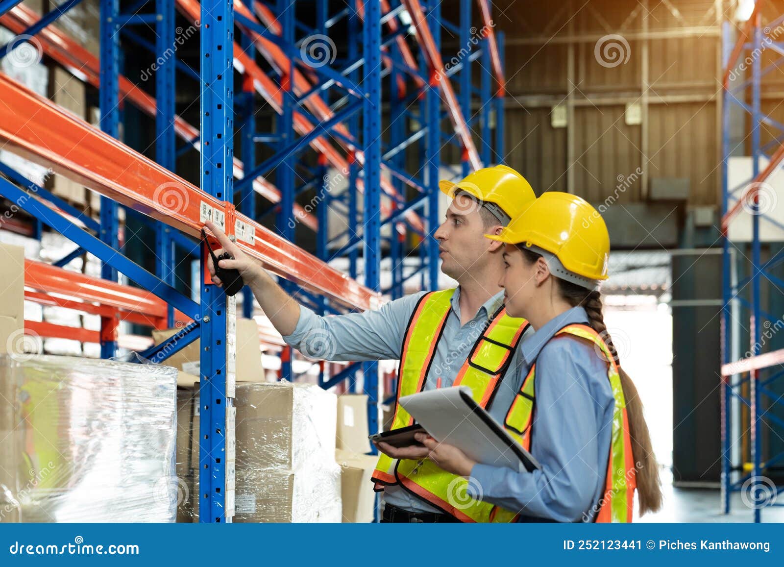 Male and Female Supervisors Hold Document is Checking the Number of ...
