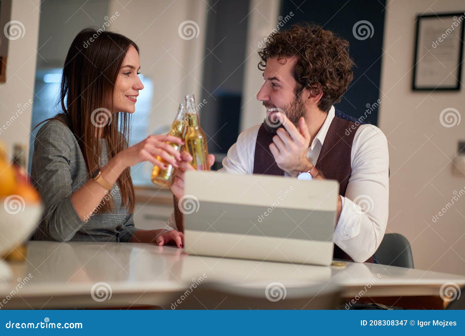Male and Female Work Colleagues Casually Hanging Out after Hours Stock ...