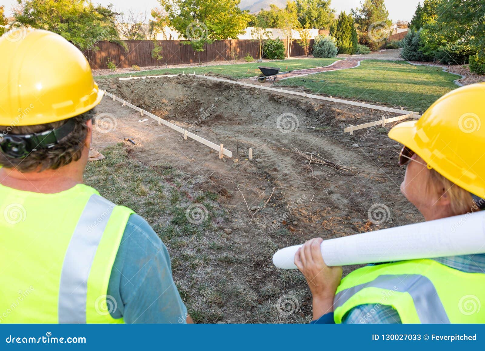 Male and Female Workers Overlooking Pool Construction Site Stock Image ...