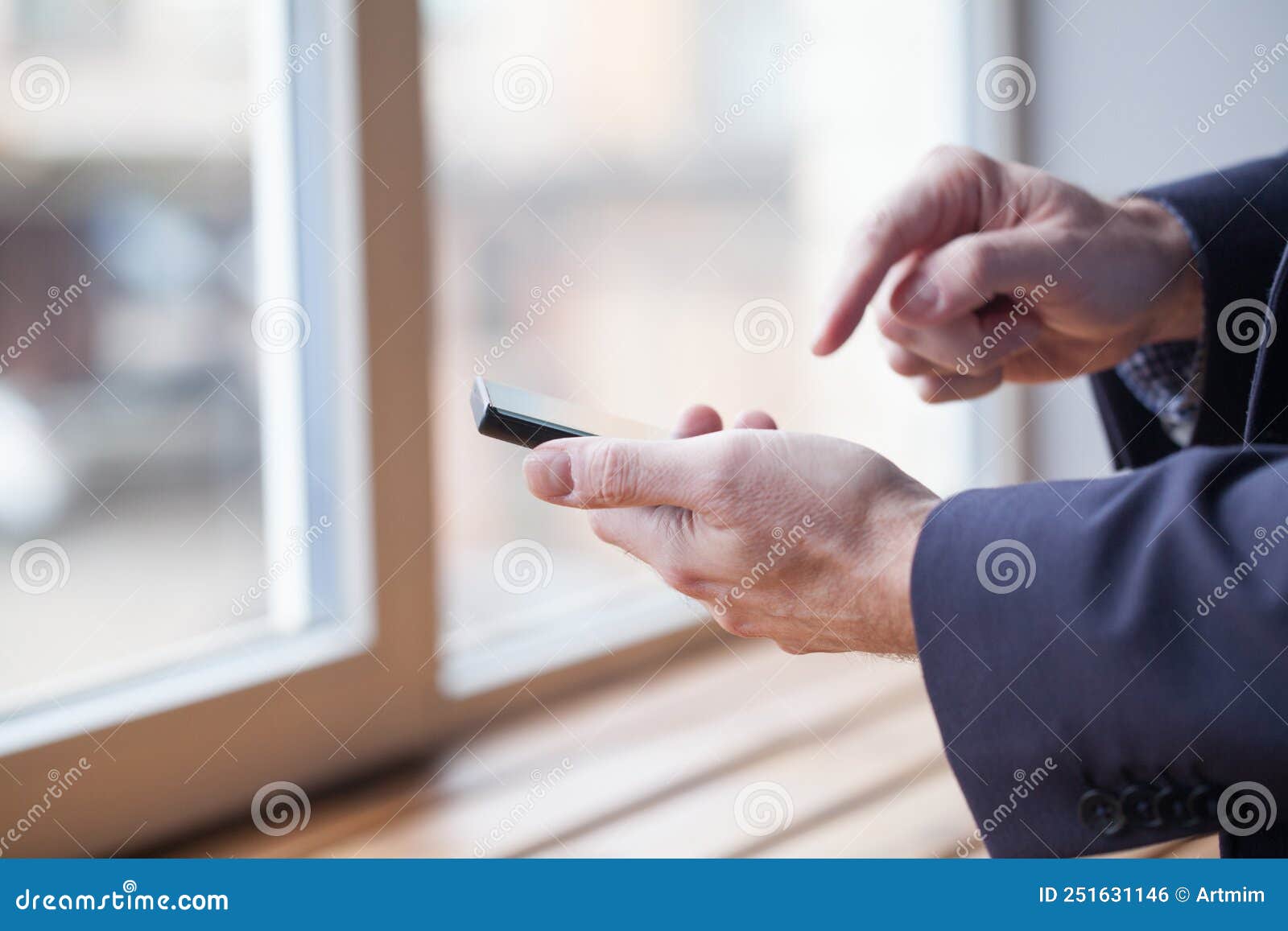 Male Finger on the Screen Using a Mobile Phone in the Office Stock ...