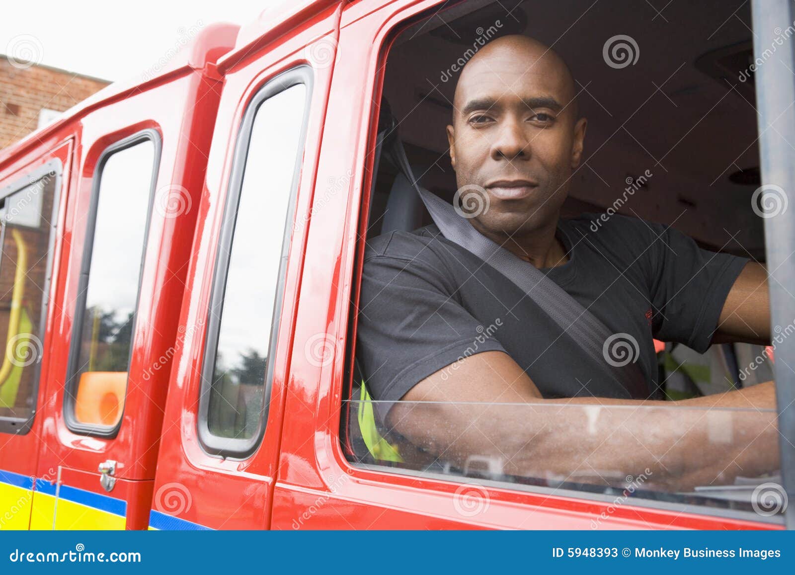 Male Firefighter Sitting in the Cab Stock Image - Image of color ...
