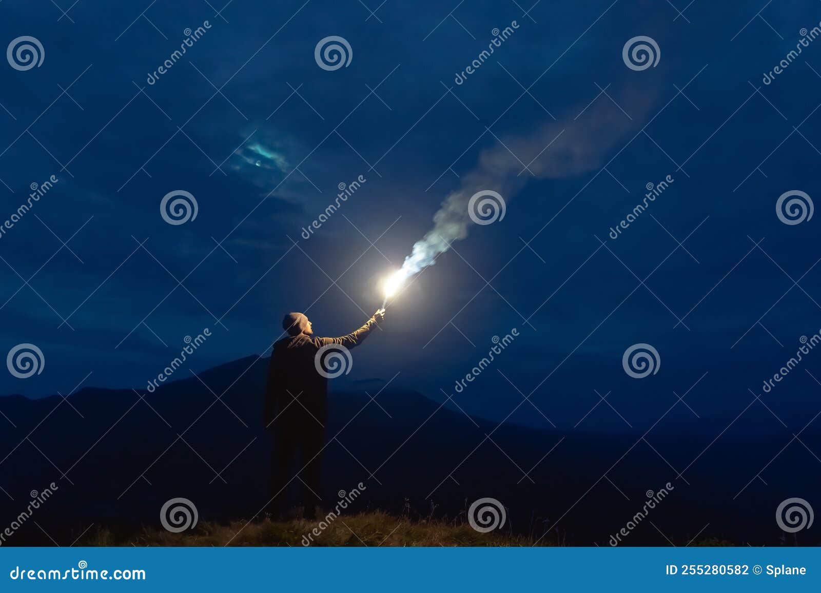 The Male with a Firework Stick Standing on a Mountain. Night Time ...