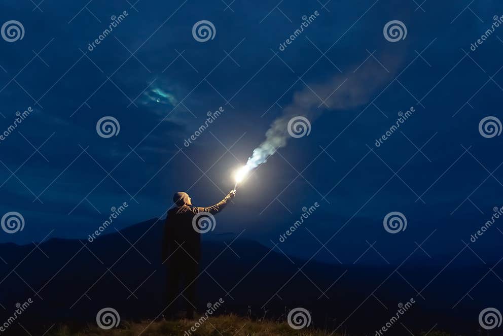 The Male with a Firework Stick Standing on a Mountain. Night Time ...