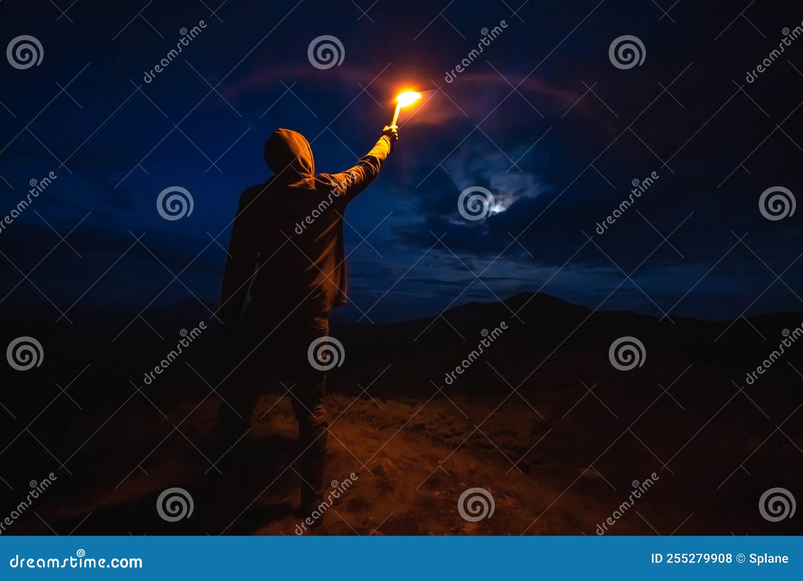 The Male with a Firework Stick Standing on the Night Mountain. Stock ...