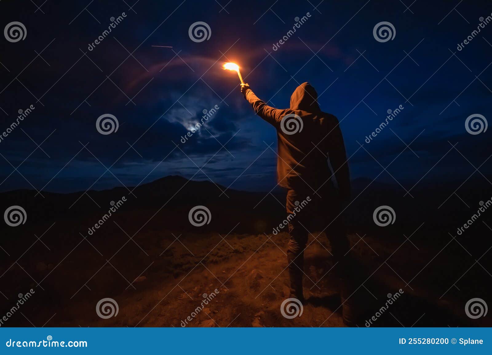The Male with a Firework Stick Standing on the Night Mountain. Stock ...