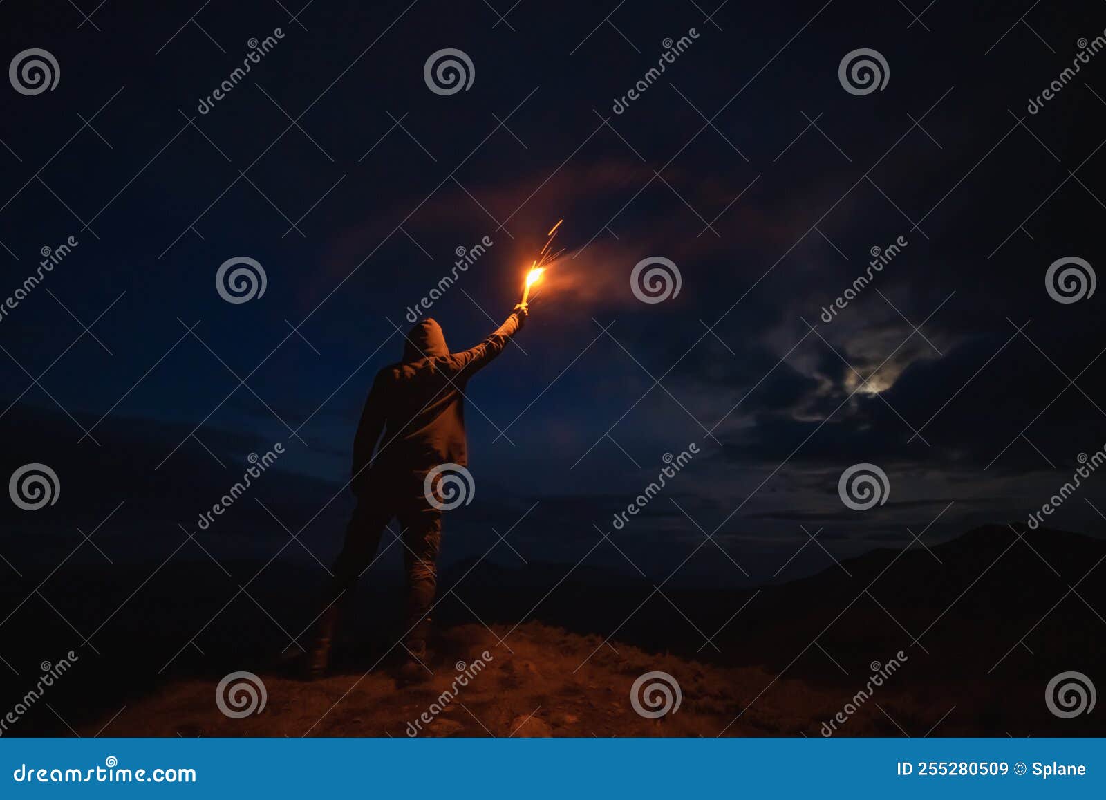 The Male with a Firework Stick Standing on the Night Mountain. Stock ...