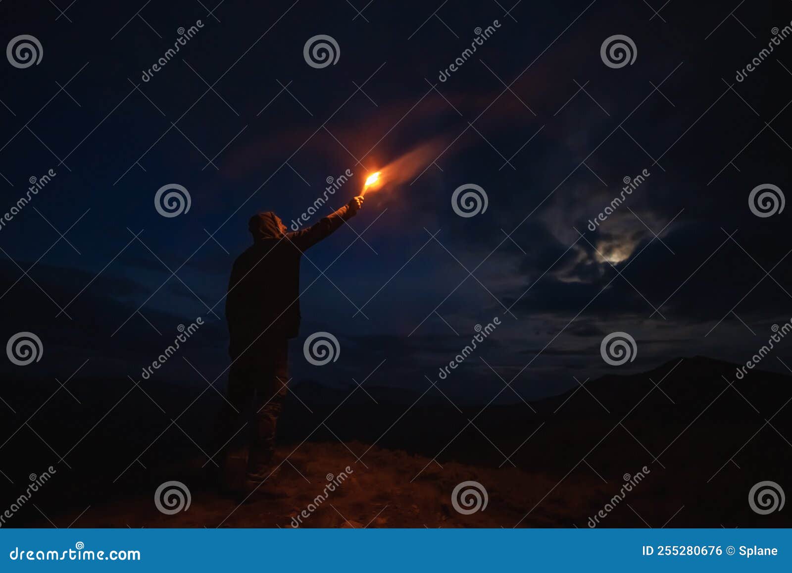 The Male with a Firework Stick Standing on the Night Mountain. Stock ...