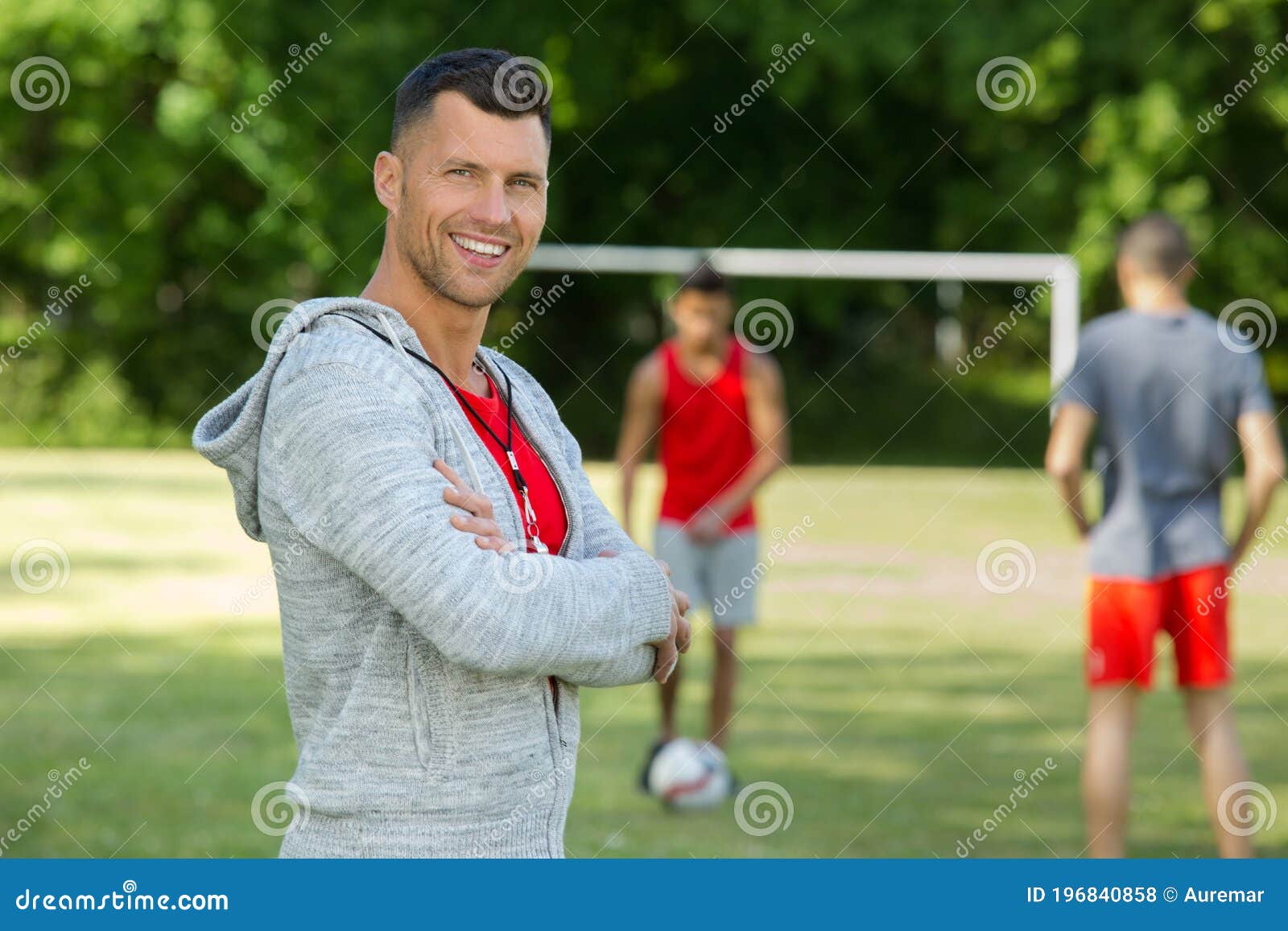 Male Football Coach Posing and Smiling Stock Photo - Image of ...
