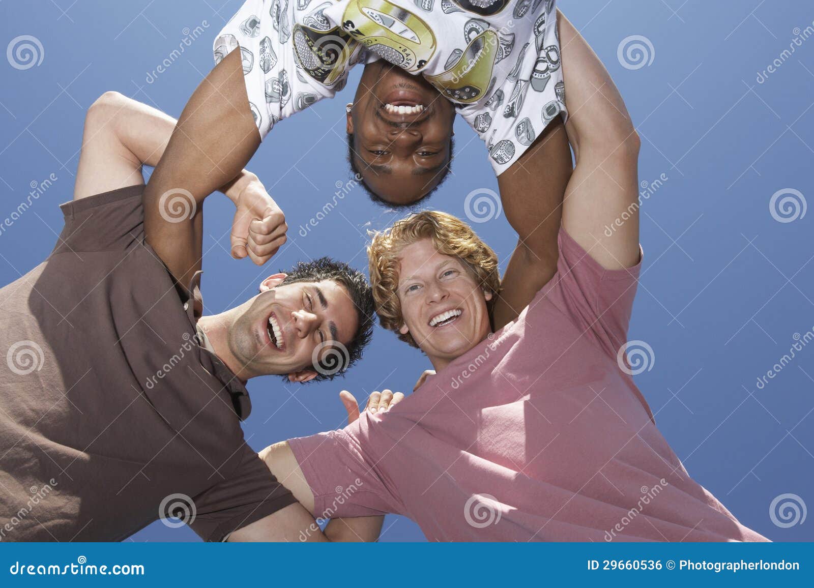 Male Friends Forming Huddle Stock Photo - Image of leisure, outdoors ...