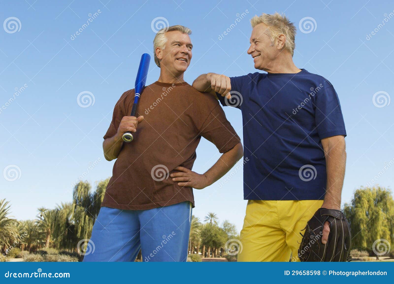 Male Friends Holding Baseball Bat and Mitt Stock Photo - Image of ...
