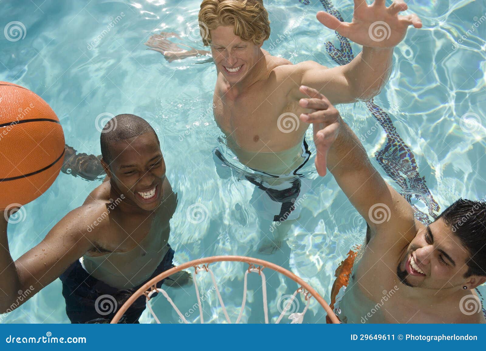 Male Friends Playing Basketball in Pool Stock Image - Image of african ...