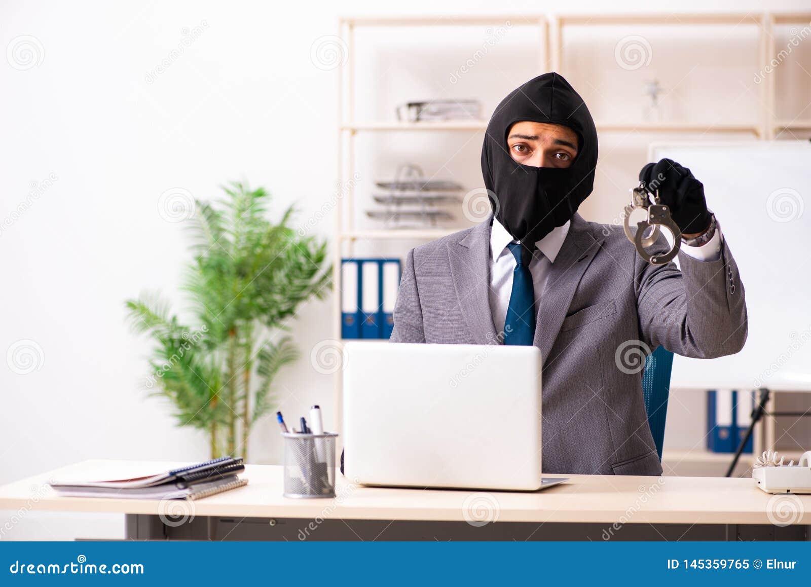The Male Gangster Stealing Information from the Office Stock Image ...