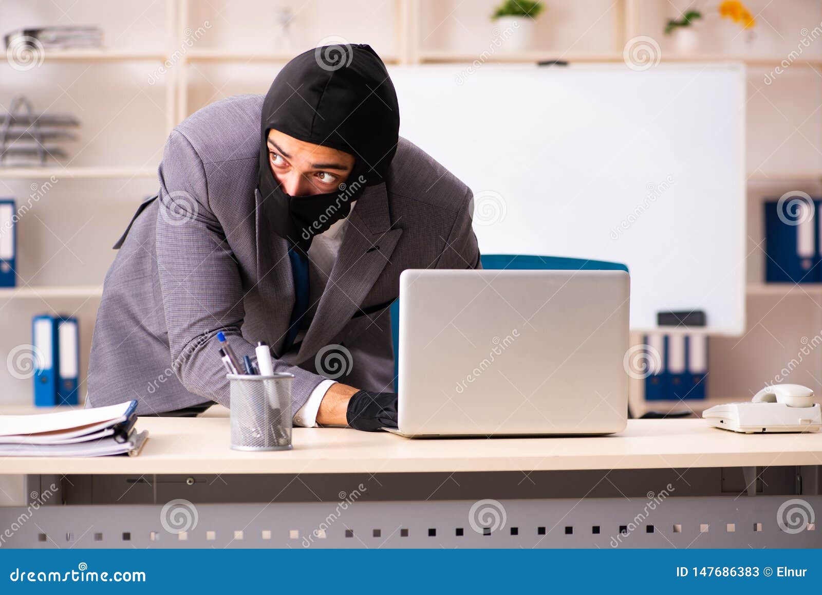 The Male Gangster Stealing Information from the Office Stock Image ...