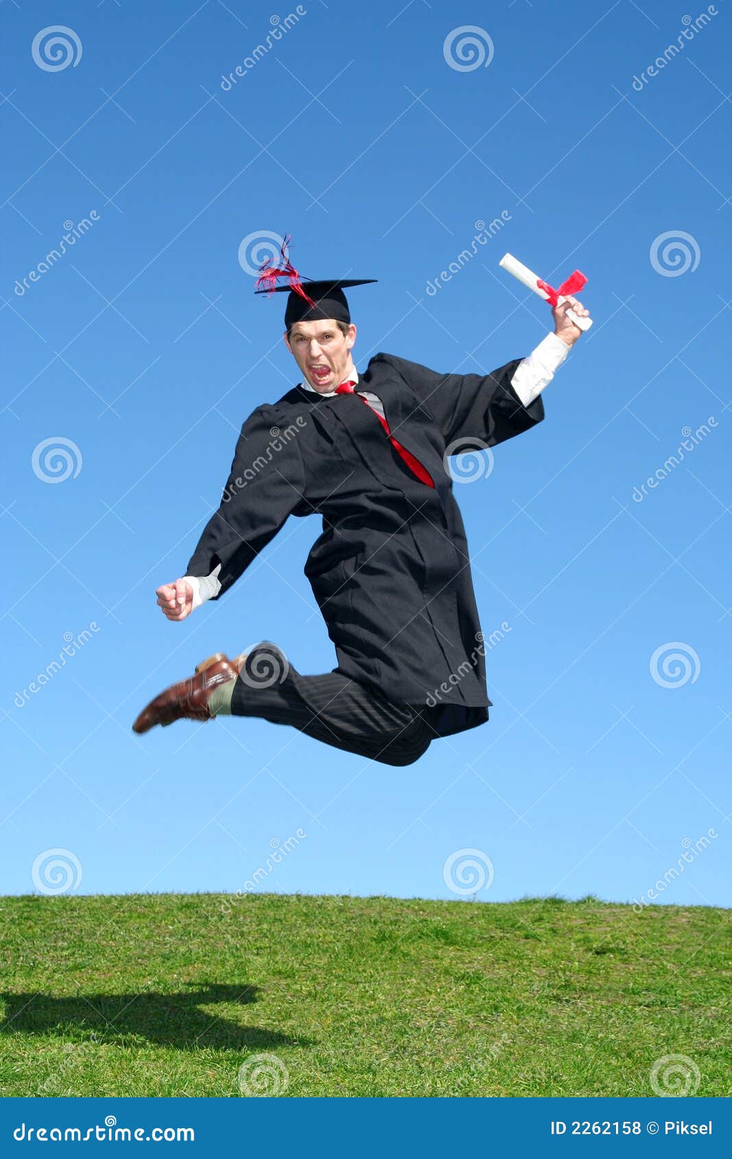 Male Graduate Jumping for Joy Stock Photo - Image of energy, jumping ...