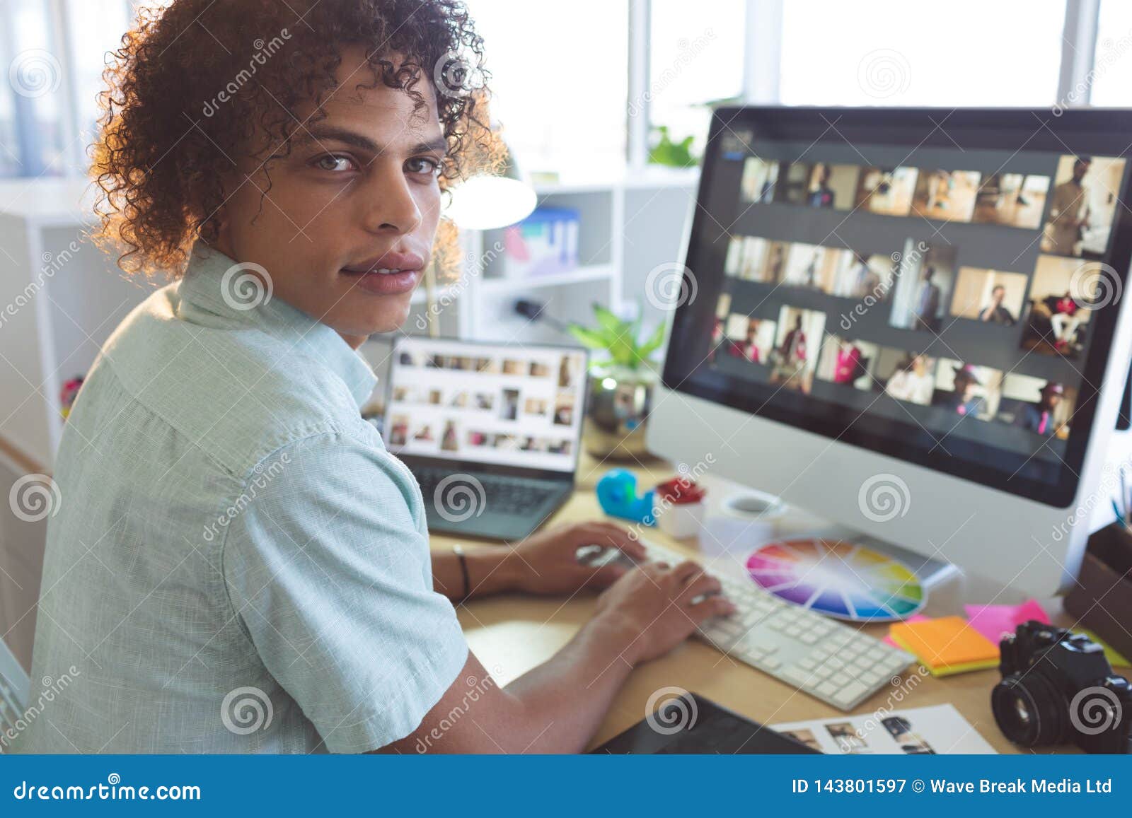 Male Graphic Designer Looking at Camera while Working Stock Image ...