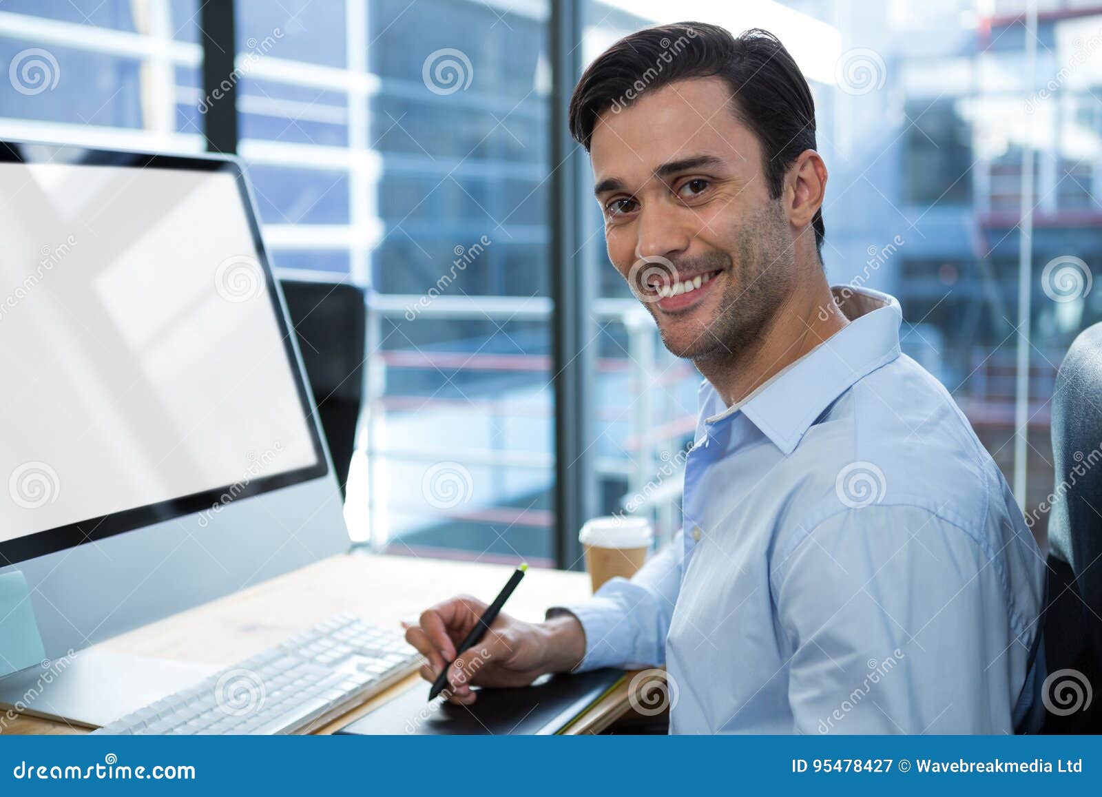Male Graphic Designer Using Graphics Tablet at Desk Stock Image - Image ...