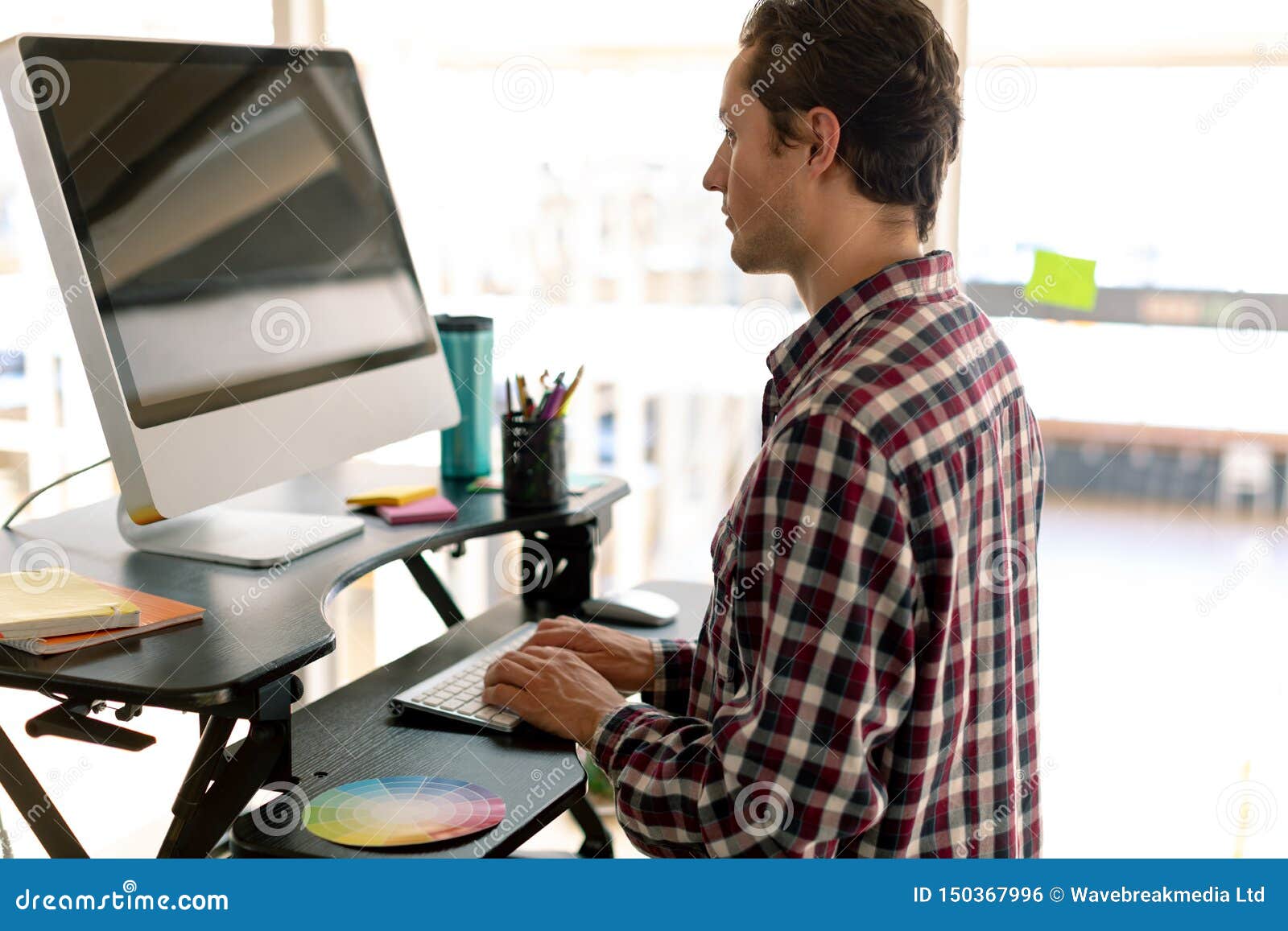 Male Graphic Designer Working on Computer at Desk Stock Photo - Image ...