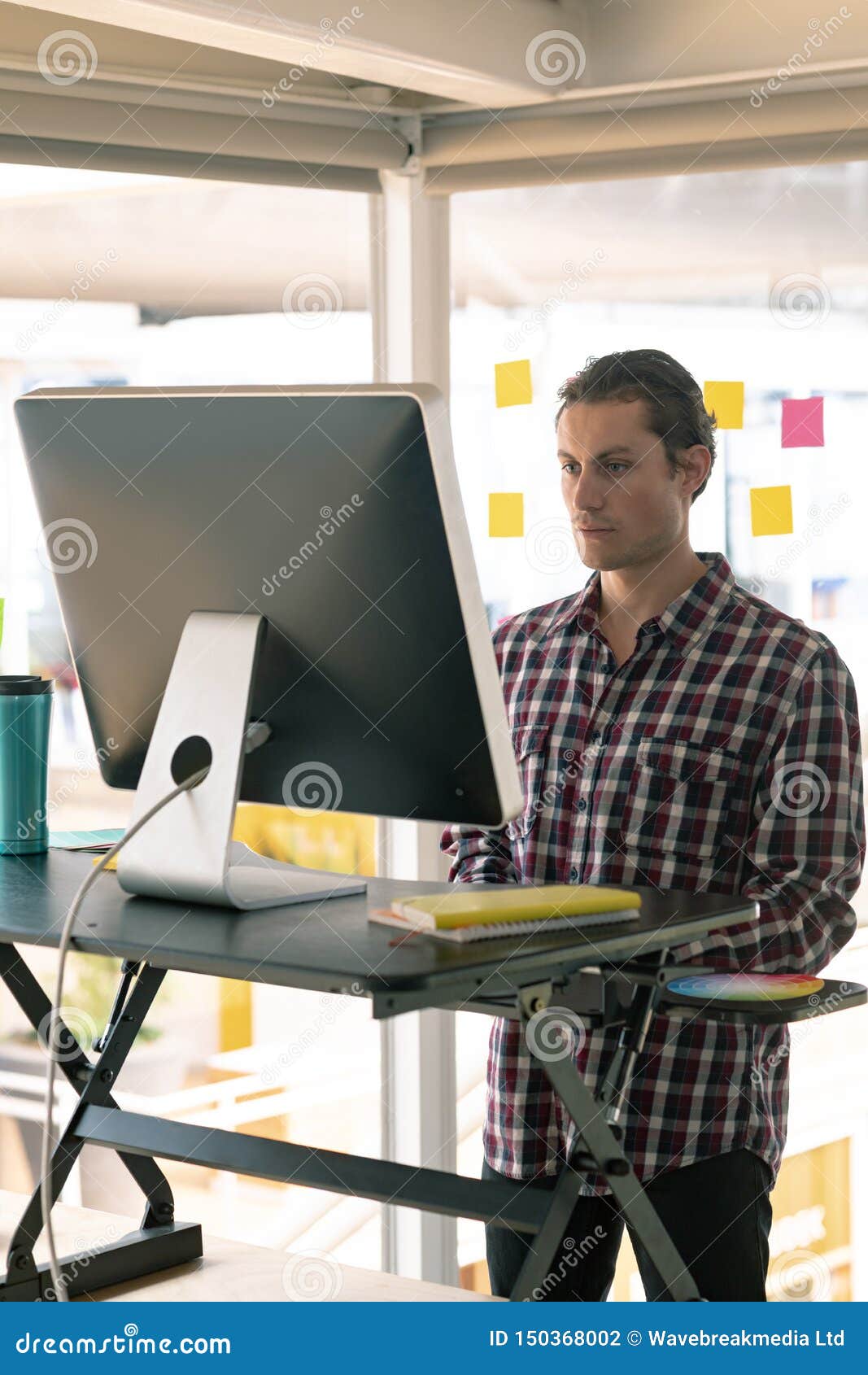 Male Graphic Designer Working on Computer at Desk Stock Photo - Image ...