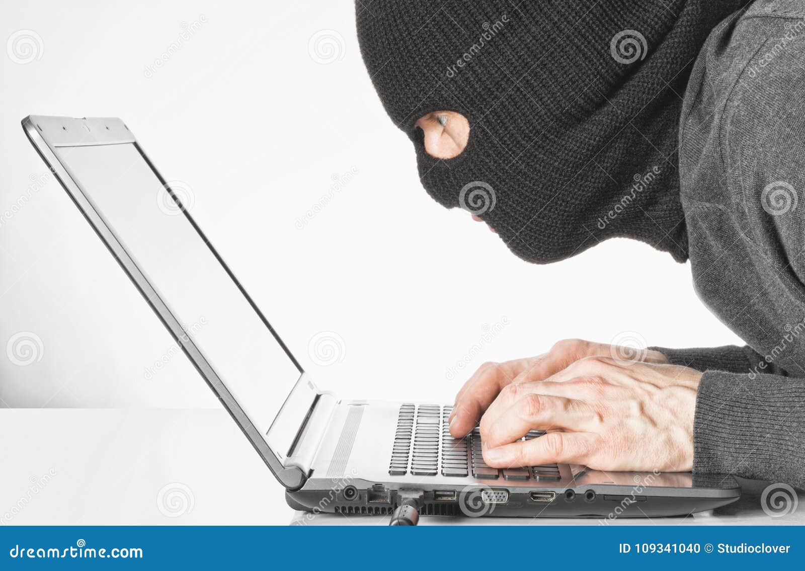 Hacker in Balaclava Writing Virus Code on Laptop Keyboard Stock Photo ...