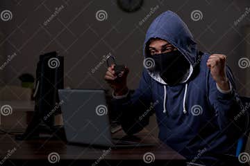 Male Hacker Hacking Security Firewall Late in Office Stock Photo ...