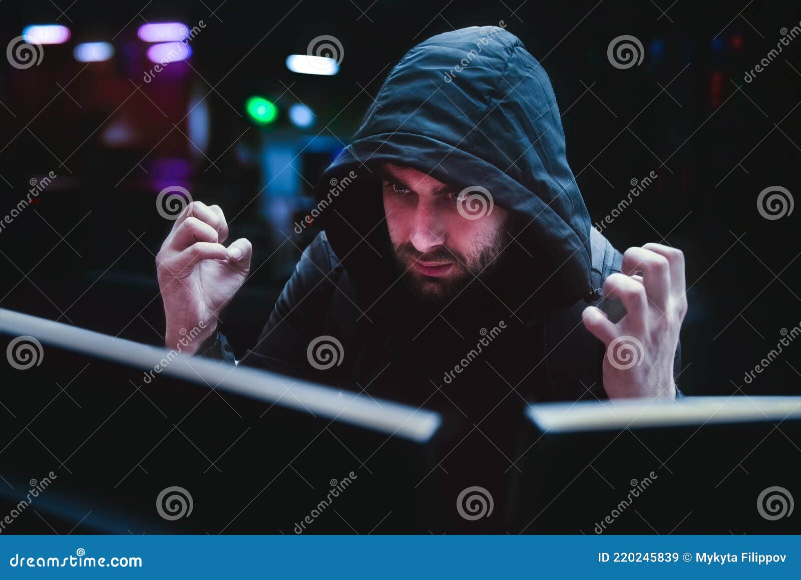 A Male Hacker in Hood Experiences Angry Emotions Over a Failed Hack ...