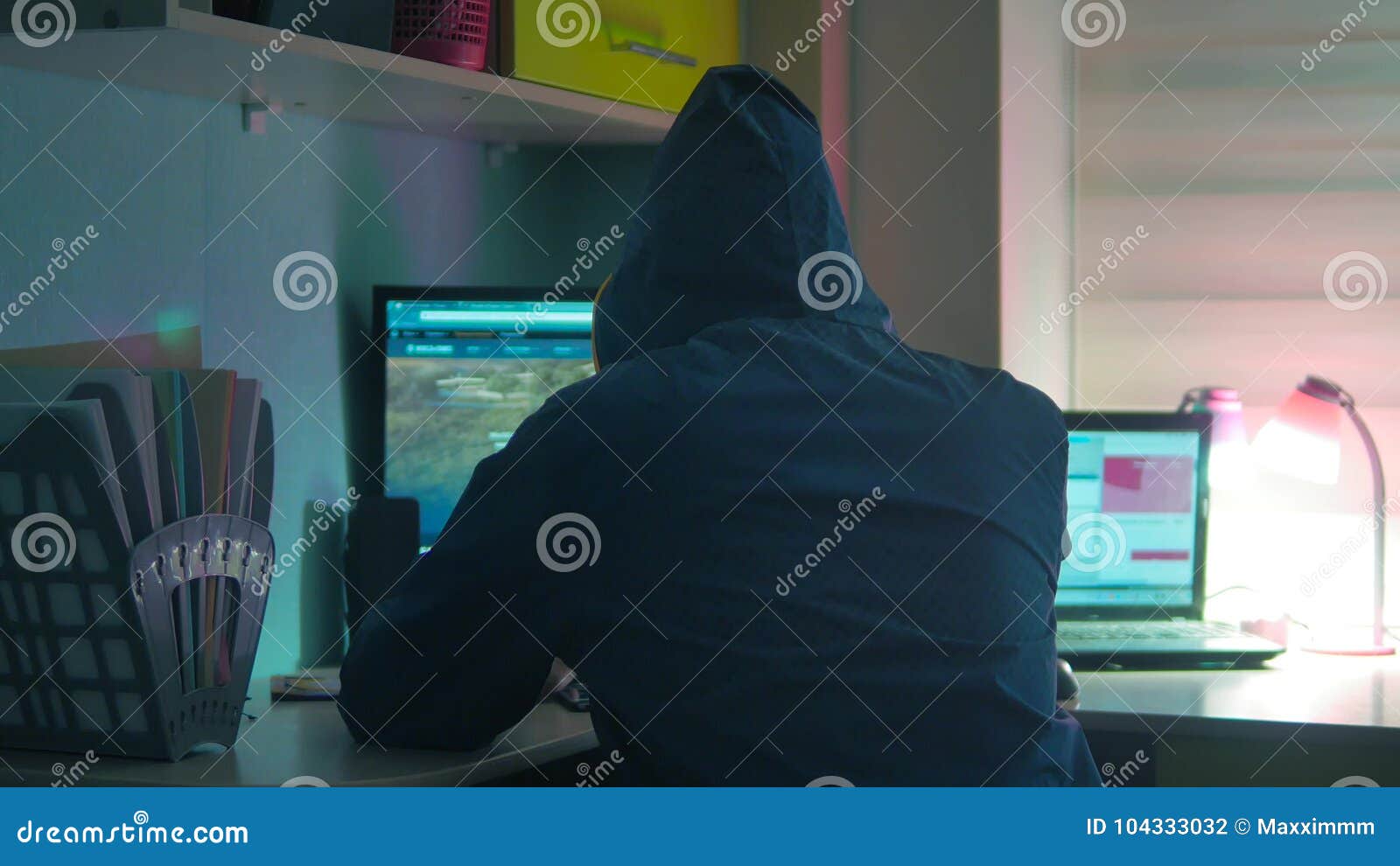 Male Hacker Internet Working on a Computer. Man Hacker in Hood Hiding ...