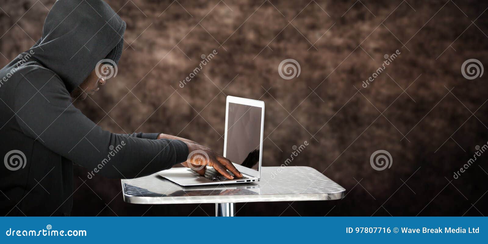 Composite Image of Male Hacker Using Laptop on Table Stock Photo ...