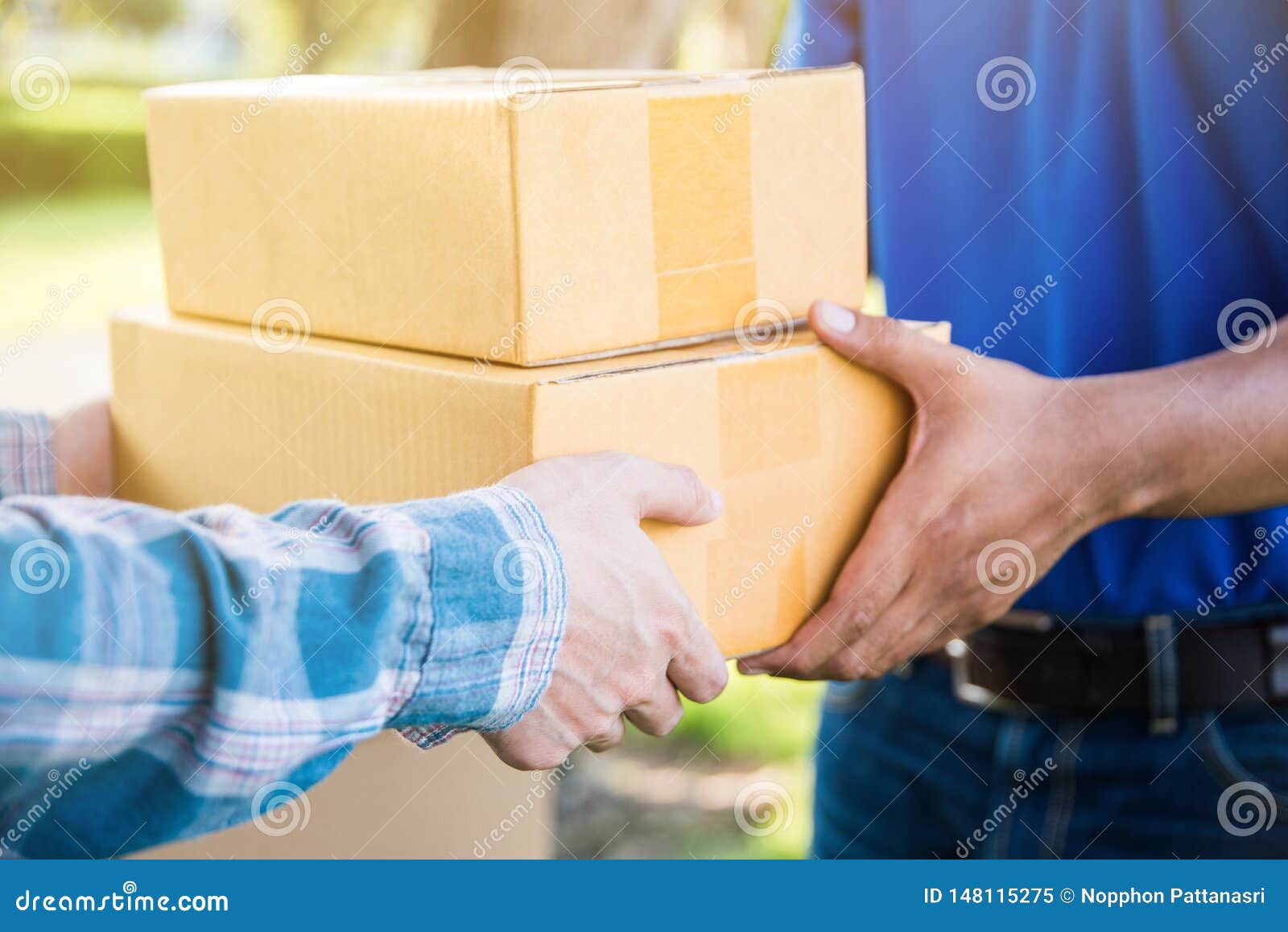 Male Hand Accepting a Delivery of Boxes from Deliveryman. Stock Image ...