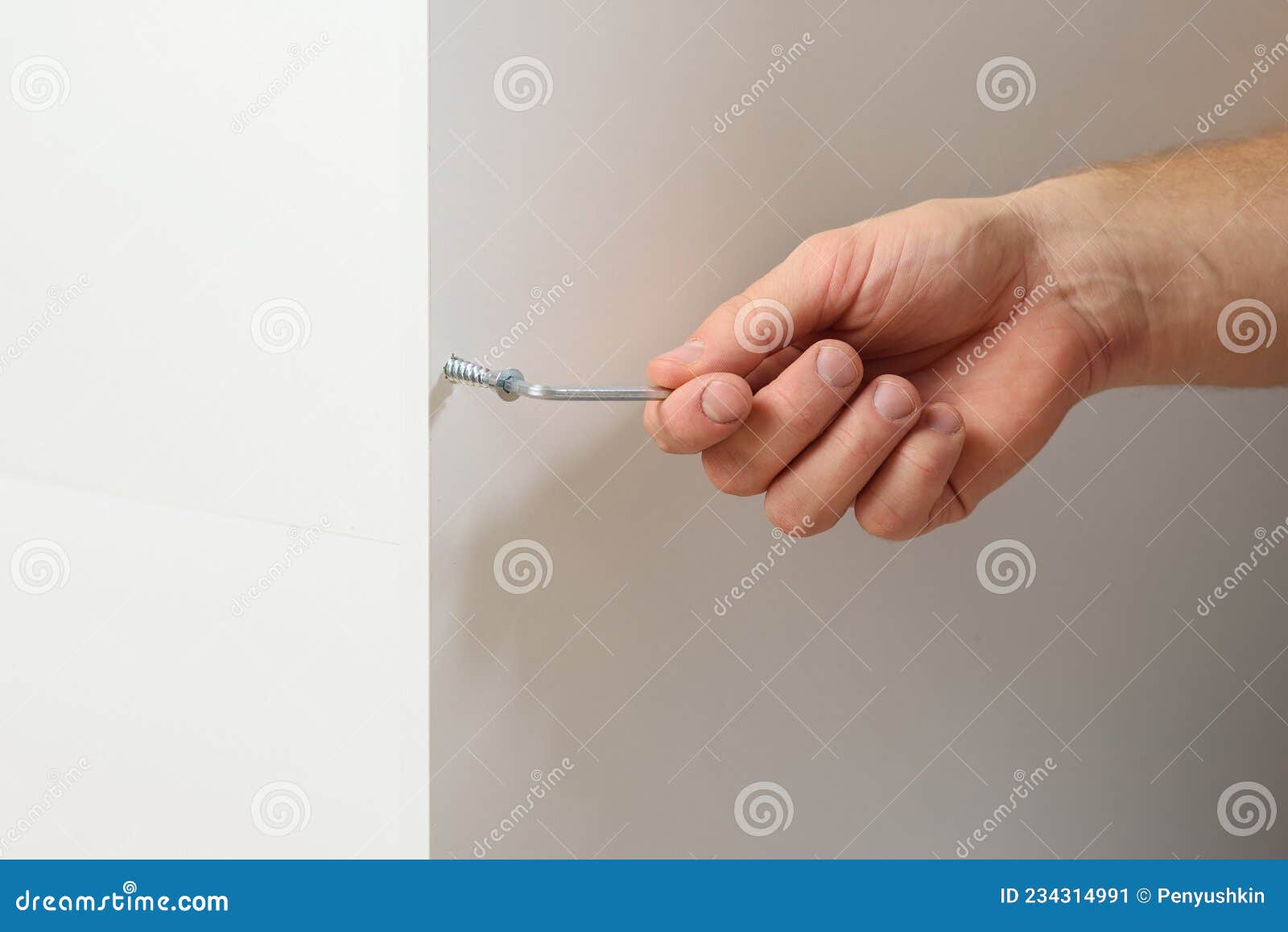 A Male Hand Assembles a New Table with a Tools. Handyman Stock Image ...