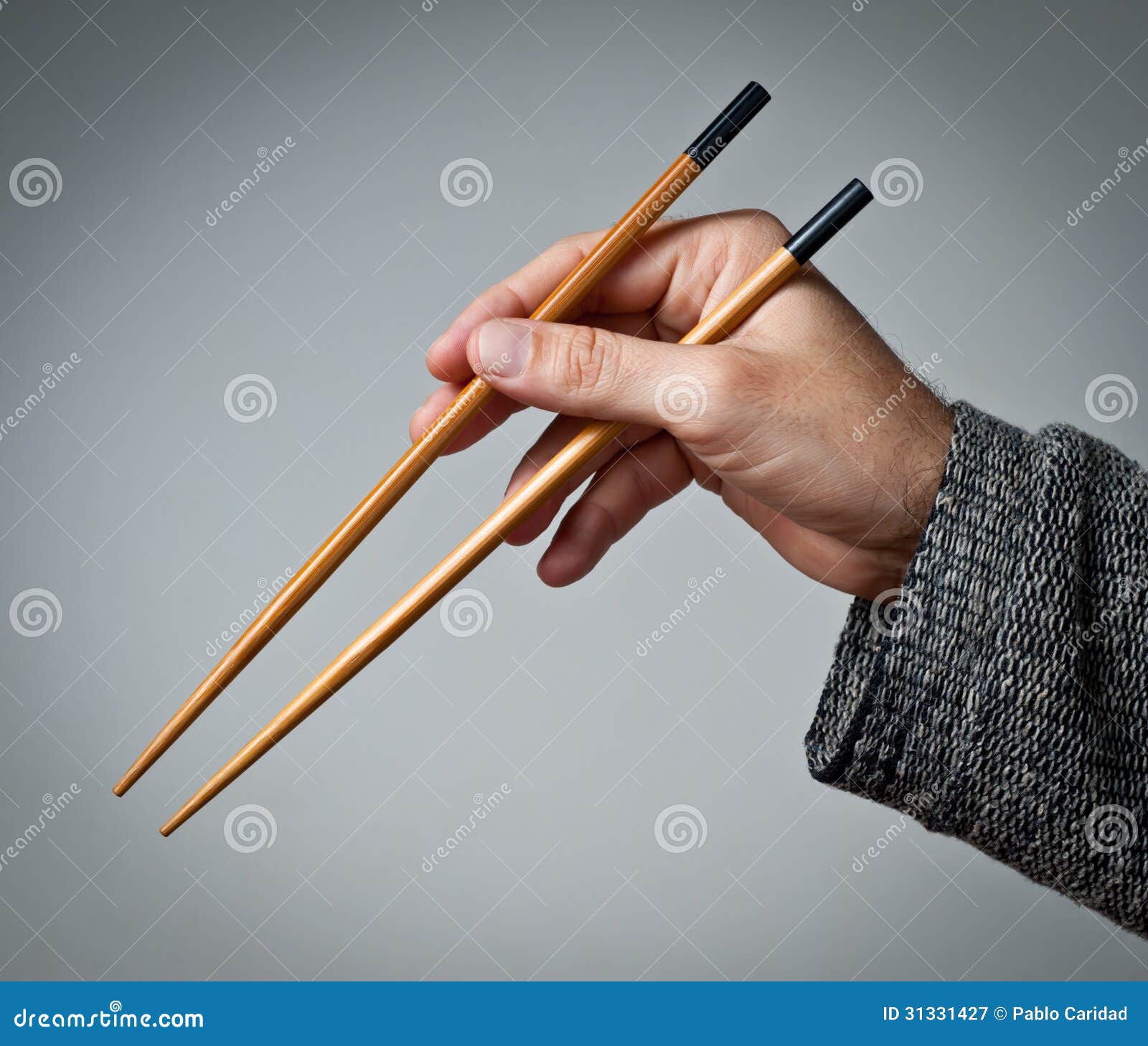 Male hand with chopsticks stock image. Image of oriental - 31331427