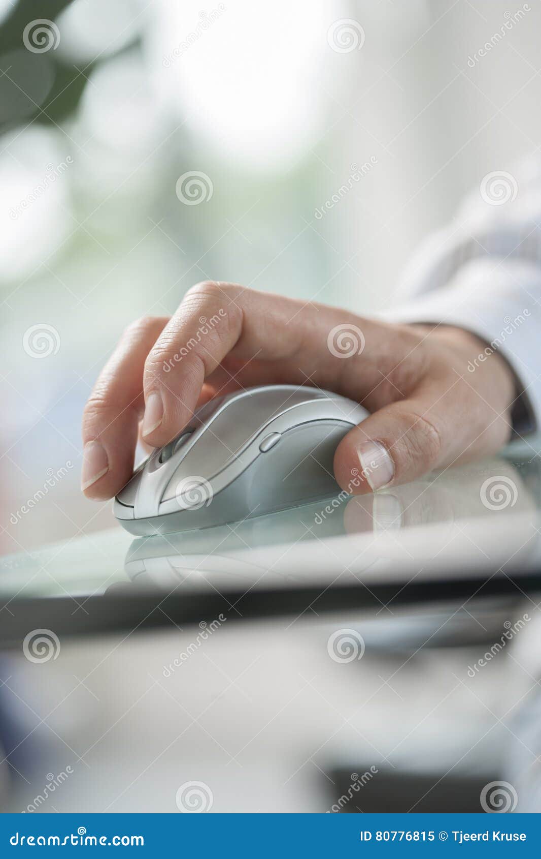 Male Hand Clicking a Cordless Computer Mouse on a Green Table Stock ...