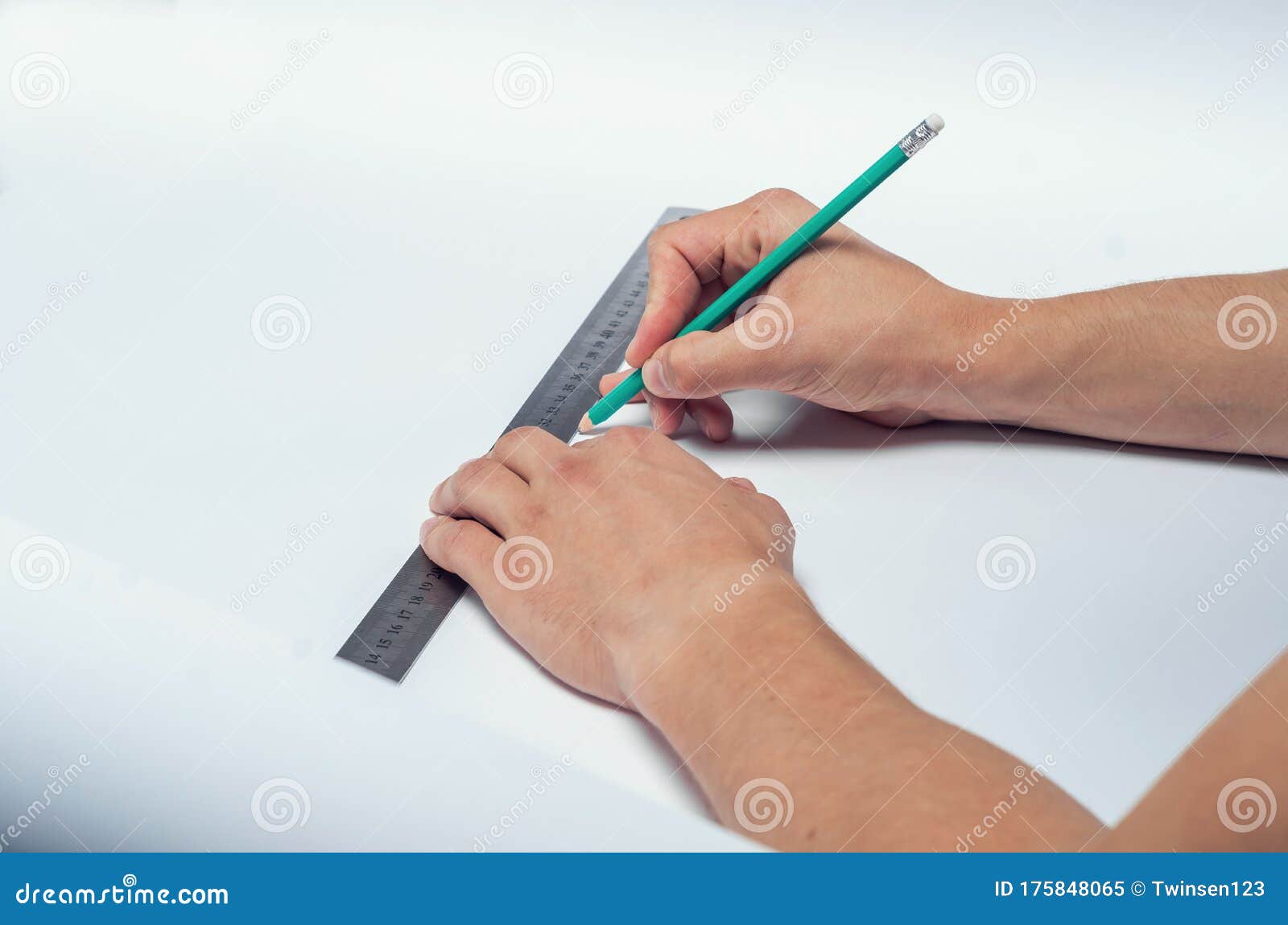 Male Hand Draws a Pencil Under a Ruler on a White Sheet of Paper Stock ...