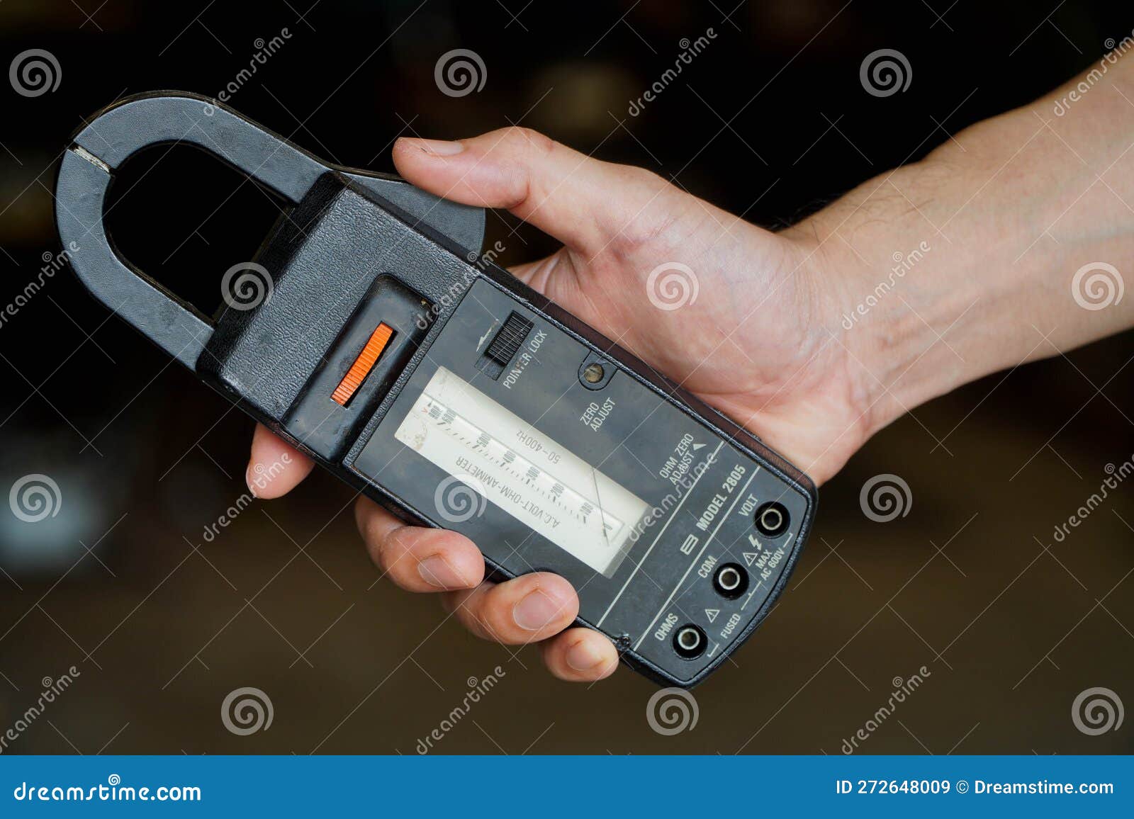 Male Hand Holding an Analog Clamp Meter,concept of Electric Current ...